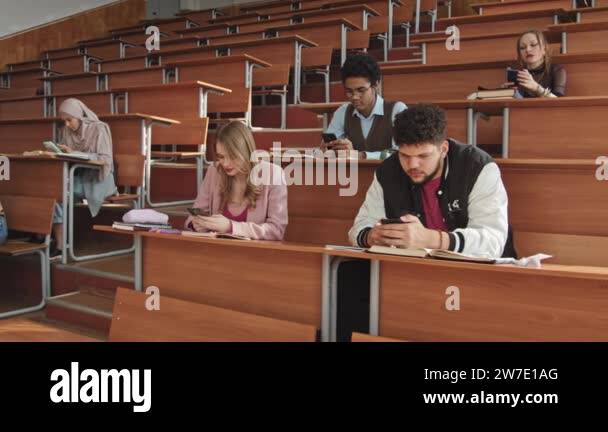 Group university students sitting desks Stock Videos & Footage - HD and ...