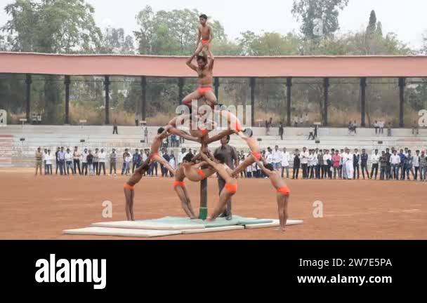 Students perform Mallakhamb, a traditional Indian sport, perform on a ...