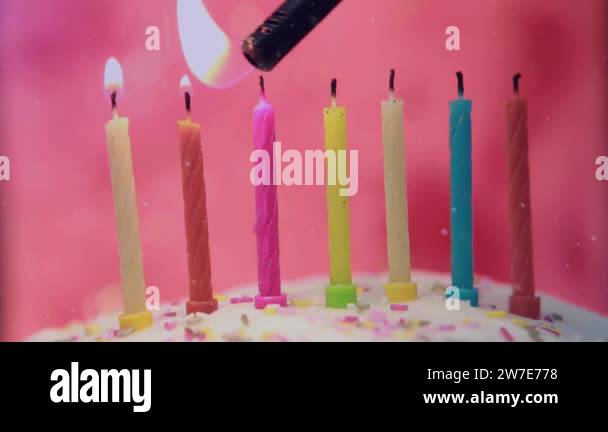 Animation of white confetti falling over colourful birthday cake ...