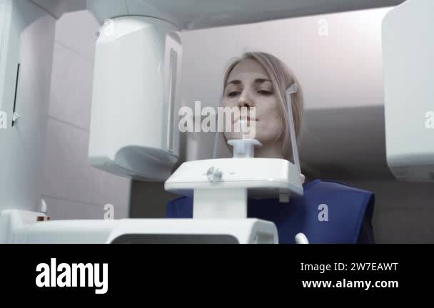 Dental jaw scanning. Patient girl inside a panaromaniac 3d scanner of ...