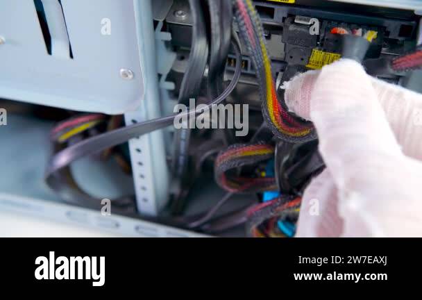 Unplugging a 4-pin power and data cable from hard disk drive on a ...