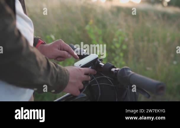 People, sports, active lifestyle concept. Cyclist using navigator ...