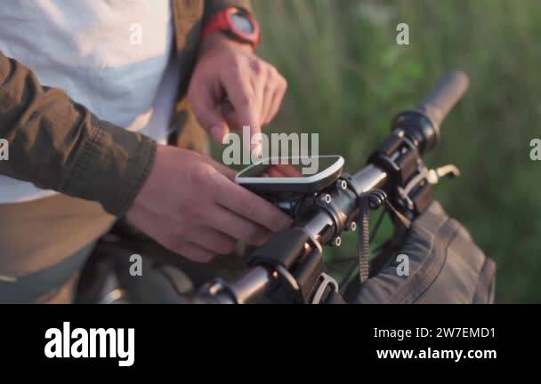 People, sports, active lifestyle concept. Cyclist using navigator ...