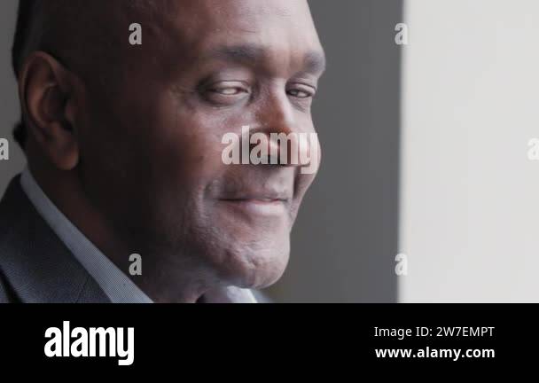 Male portrait of african american mature afro man with pensive dreamy ...