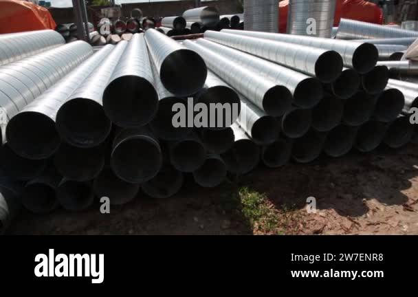 Ventilation pipe warehouse. Steel pipes, parts for the construction of ...