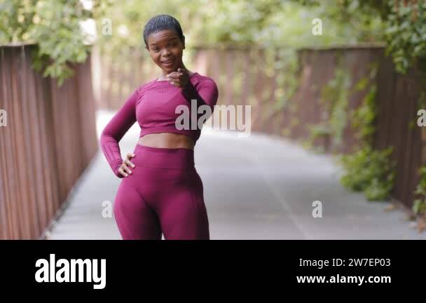 Smiling young happy millennial girl looking at camera makes hand ...