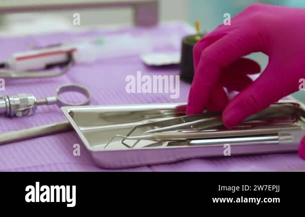 Closeup Dentist tools . Macro treating teeth to patient in clinic ...