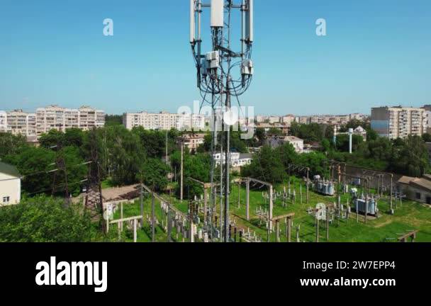 Transformers, utility towers, and power lines cover the grounds of an ...