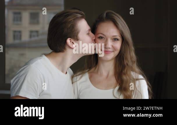 Caucasian young married couple lovers of millennials stand together ...