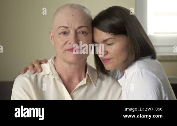 Young woman hugs her sick mom after chemotherapy. Love, care and ...