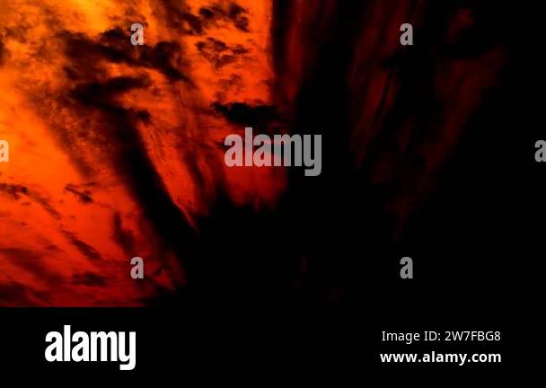 Time laps. Terrible bloody clouds fly across the dark sky. Terrible ...