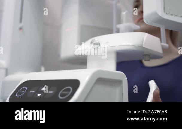 Patient girl inside a panaromaniac 3d scanner of teeth. Diagnostic ...
