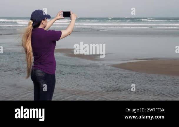 A Moroccan Arab Muslim woman takes panoramic pictures, a panoramic ...