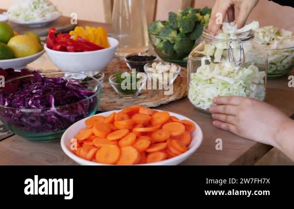 Filling a jar with cabbage, adding black pepper. Fermenting, preserving ...