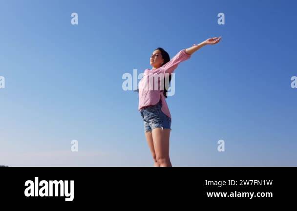 Woman arms wide sun Stock Videos & Footage - HD and 4K Video Clips - Alamy