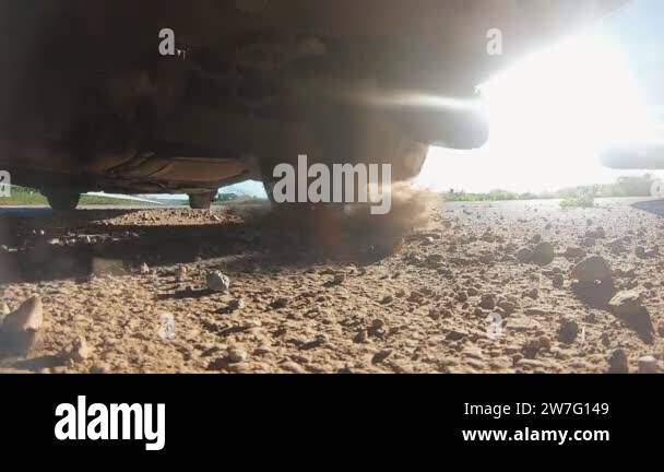 Wheel of a black car slipping on a asphalt road during start of ...