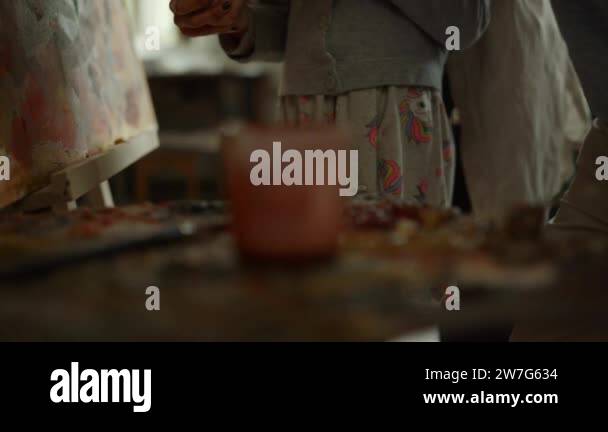 Creative family drawing in art studio. People hands mixing oil paint ...