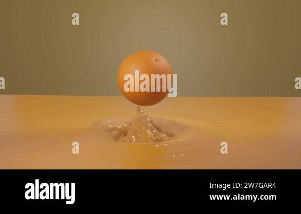 Orange flying in the mid air and falling in the orange juice. Animation ...
