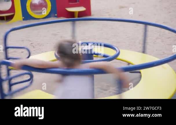 Little Girl Spinning Merry Go Round Carousel Amusement Park Playground ...