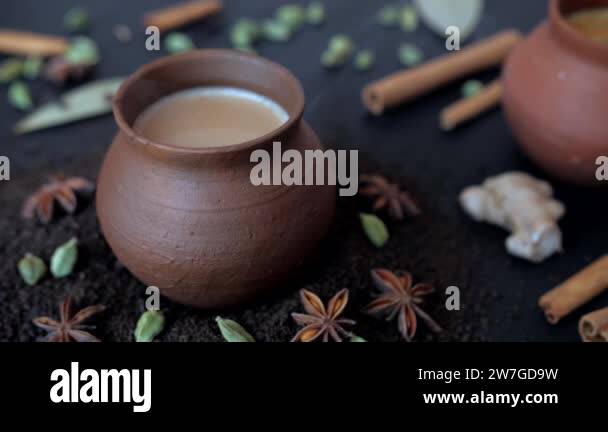 Smoke coming out of steaming hot and flavored milk tea served in an ...