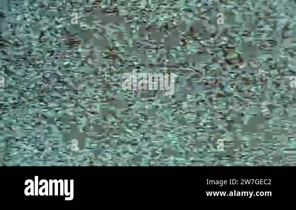 Analogue noise and flickering on an old TV screen. Abstract image of ...