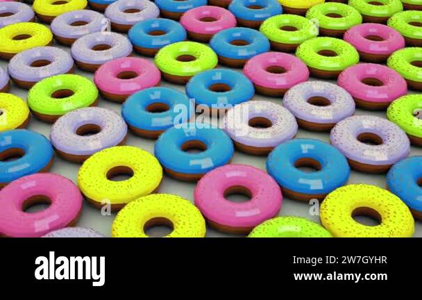 Lots of colored donuts . The camera moves over the background of the ...