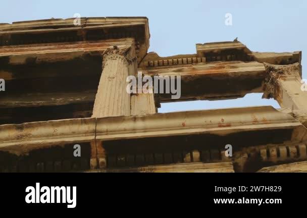 Ancient Roman style construction with tall column pillars crowned with ...