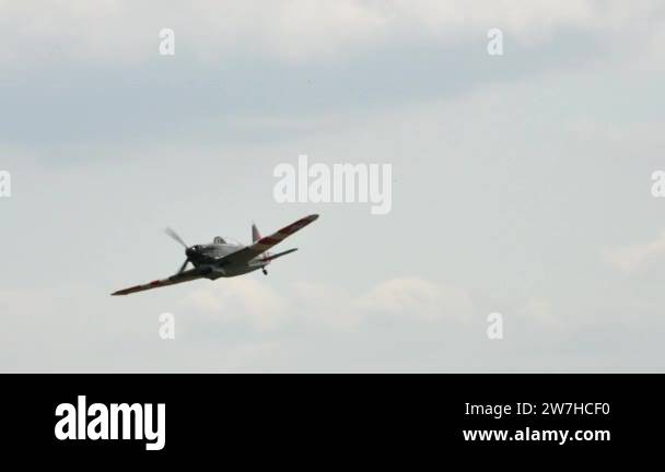 Fighter airplane fast and low pass with Swiss flag white cross on the ...