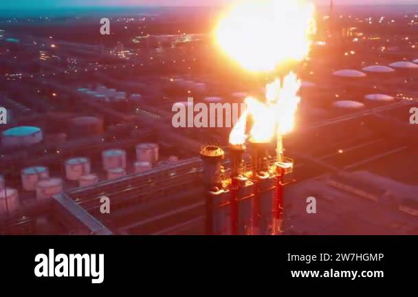 Gas-flaring pipes of the oil refinery filmed at night Stock Video ...
