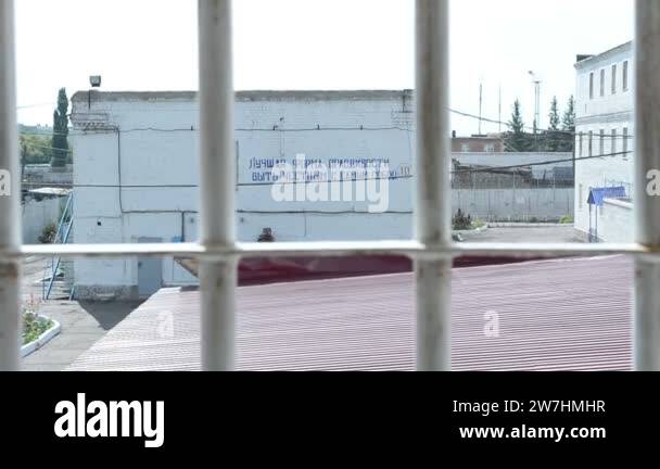 A typical landscape from the window of the prison behind bars in a ...
