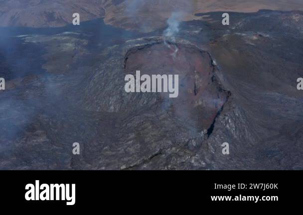 Stunning aerial view flying towards Fagradalsfjall volcano fissure cone ...