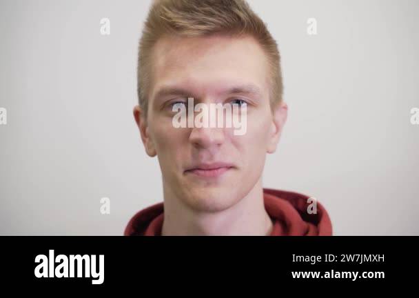 Young toothless man smiles. He opens his mouth and you can see braces ...