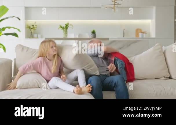 Elderly grandfather with his grandchildren have fun, have fun with his ...