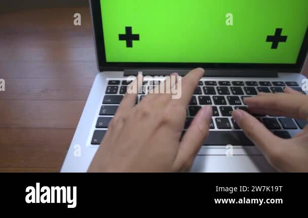 Woman hands typing and scrolling on a trackpad in a laptop computer ...
