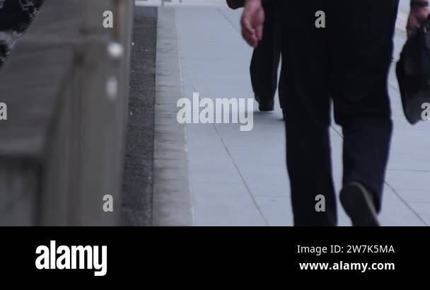 A slow motion of body parts of walking people at urban city in Tokyo ...