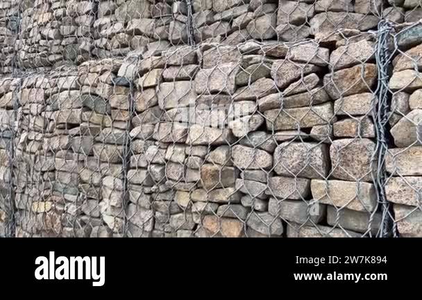 Gabion wall constructed using steel wire mesh basket. Stone walls ...