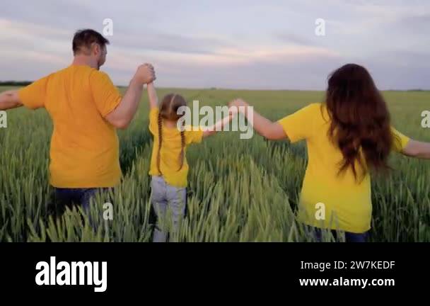 agriculture, happy family running in green wheat field, farm life in ...