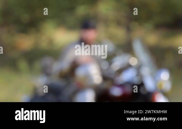 Smooth transition of focus from bokeh to a biker in medieval knight's ...