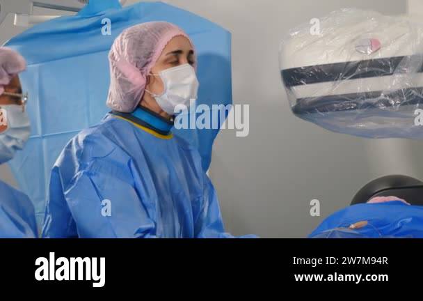 Vascular surgery. Doctor performs endovascular operation with ...