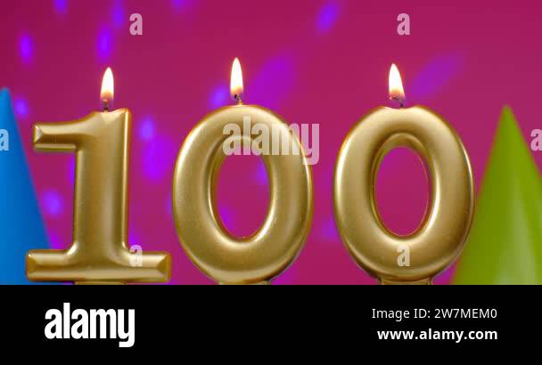 Burning birthday cake candle number 100. Happy Birthday background ...