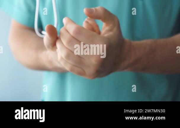 Doctor applies disinfectant on his hands. Medic inflicted on arm ...