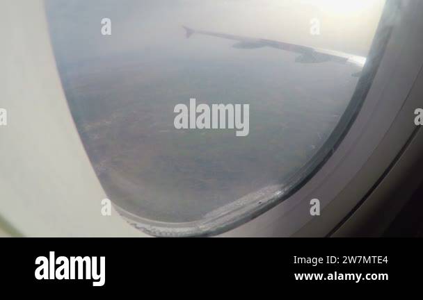 Aircraft shaking while flying in turbulence zone. Passenger pov of ...