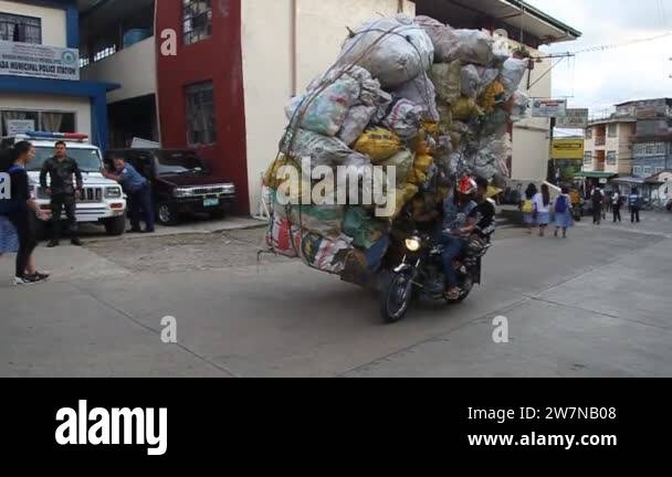 Overloaded tricycle Stock Videos & Footage - HD and 4K Video Clips - Alamy