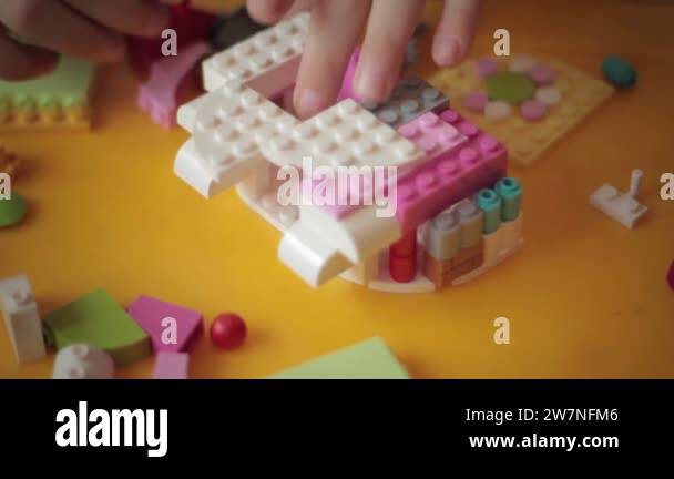 close up of kid hand moving lego construction 6 Stock Video Footage - Alamy