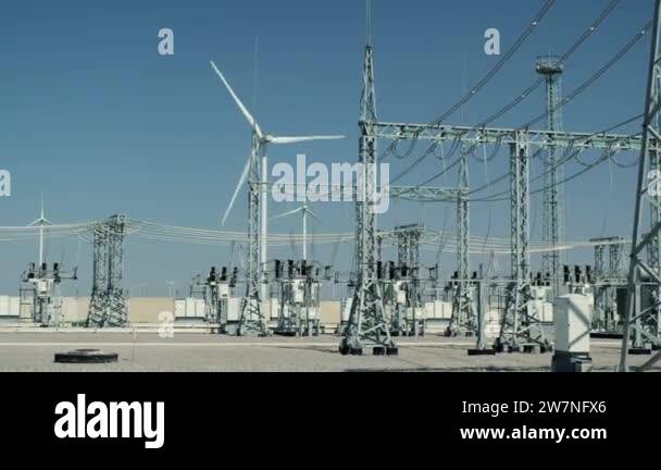 Windturbine generates electricity by high voltage substation Stock ...