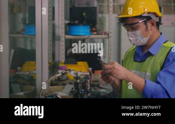 Asian factory worker technician man operating measuring steel size of ...