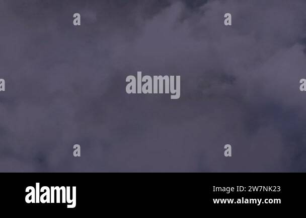 Airplane flying through heavy thunderstorm clouds, lightning bolts ...