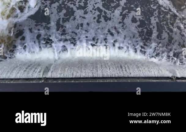 4k Small waterfall, top view. Gateway with falling water. Slow motion ...