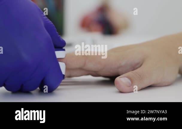 The doctor checks the patients oxygen saturation. Concept of blood ...