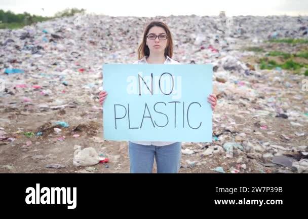Ecology activist holding No Plastic poster. woman or girl standing by ...